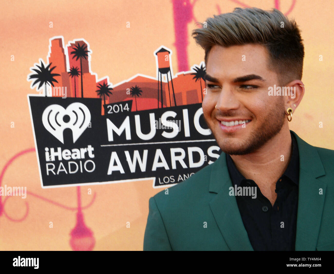Stage actor and singer-songwriter Adam Lambert attends the I Heart ...