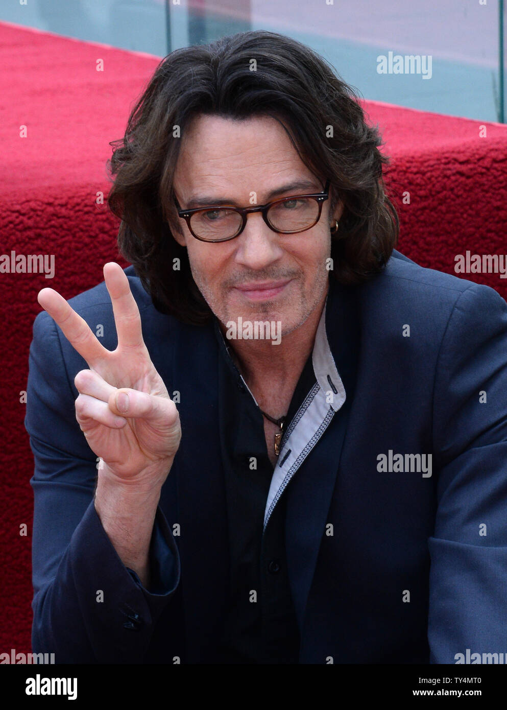 Musician, singer and songwriter Rick Springfield of Australia flashes a ...