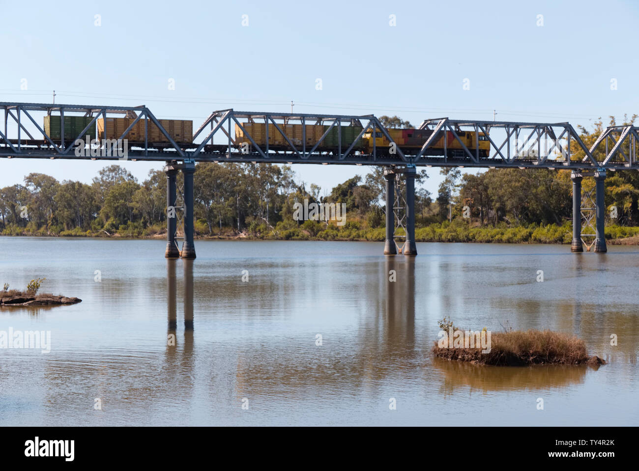 Freight train crossing the Kolan River at Avondale Queensland Australia ...