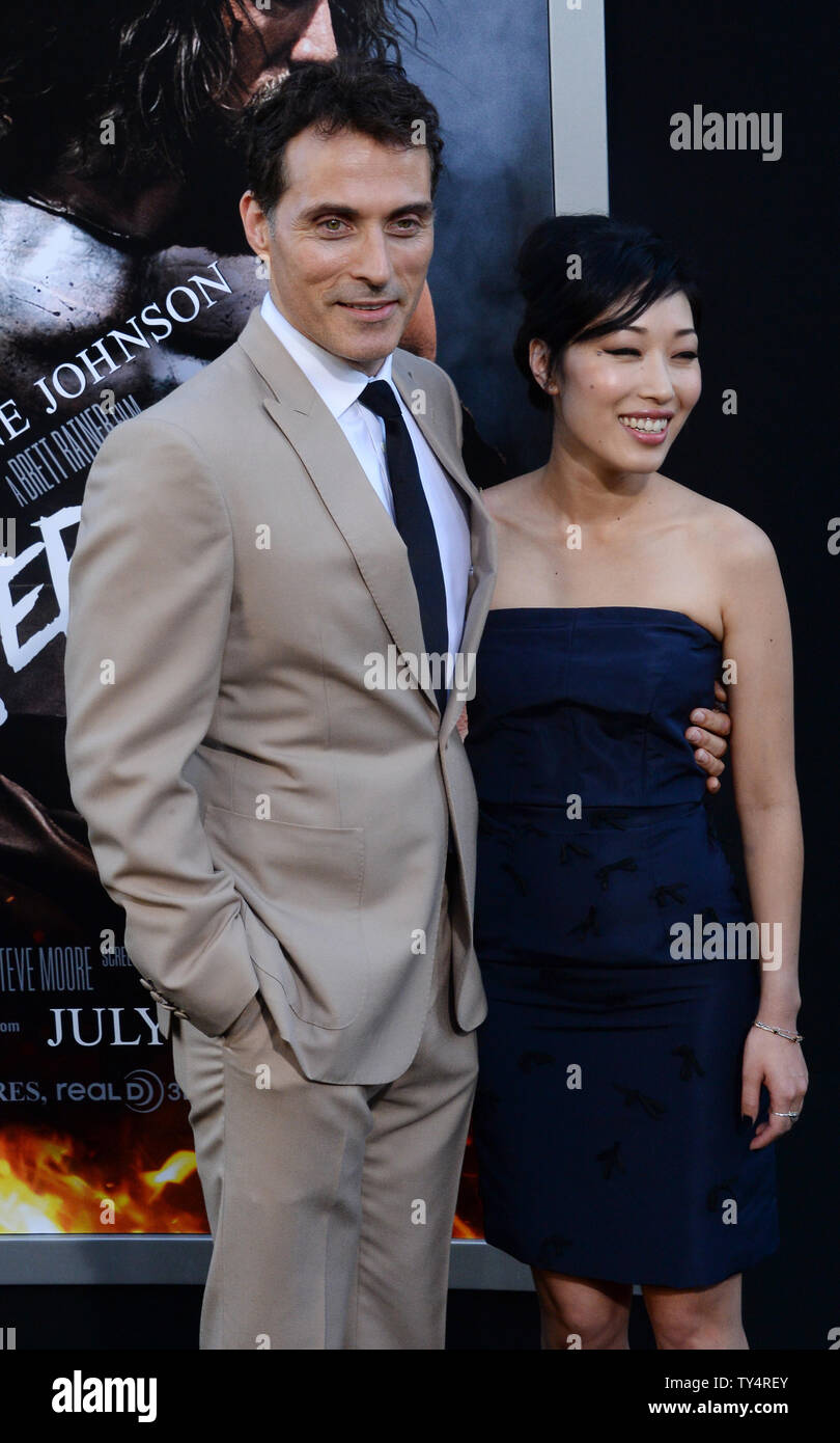 Cast member Rufus Sewell and his girlfriend Ami Komai attend the premiere of the motion picture ...
