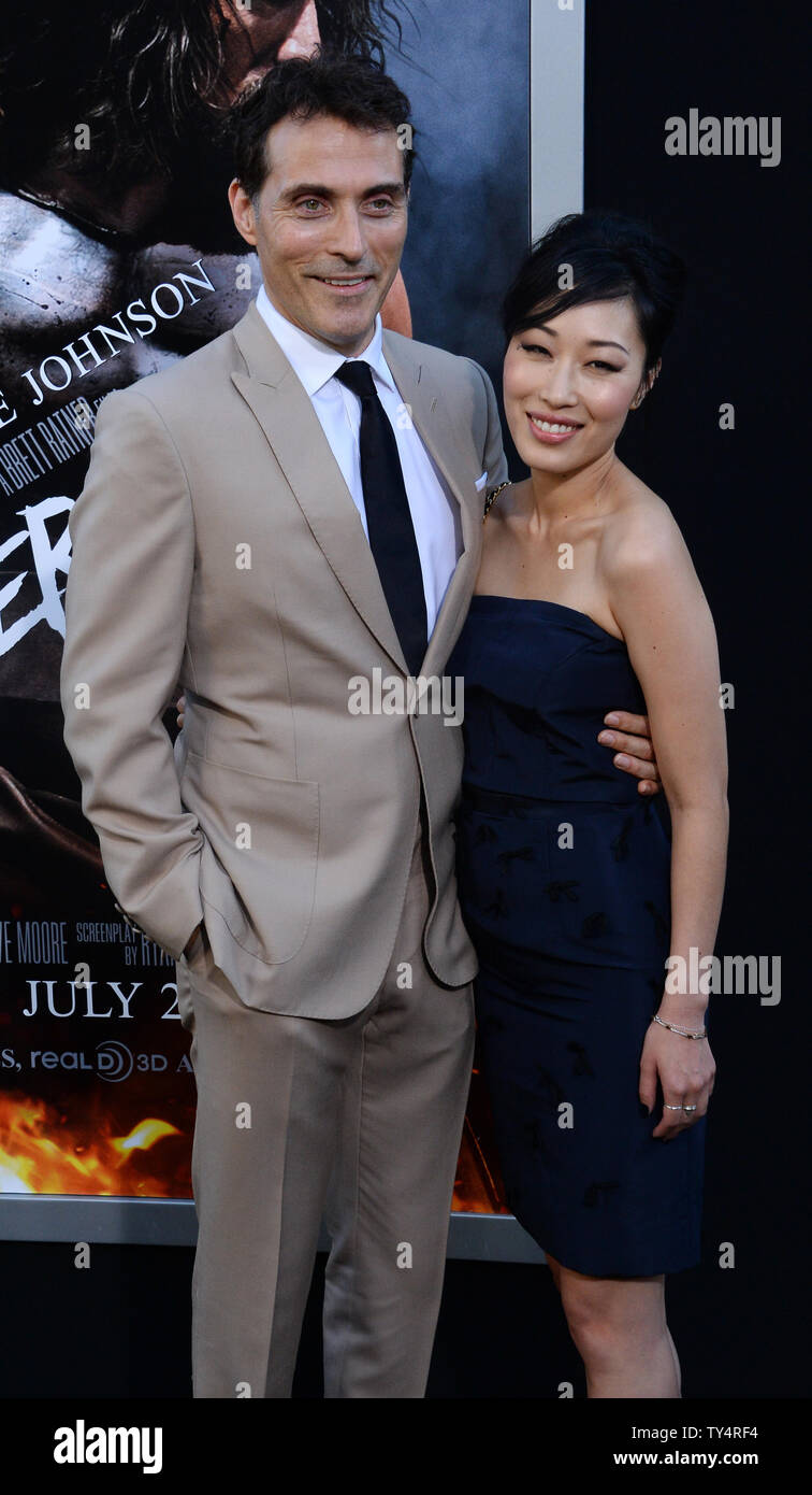 Cast member Rufus Sewell and his girlfriend Ami Komai attend the premiere of the motion picture ...