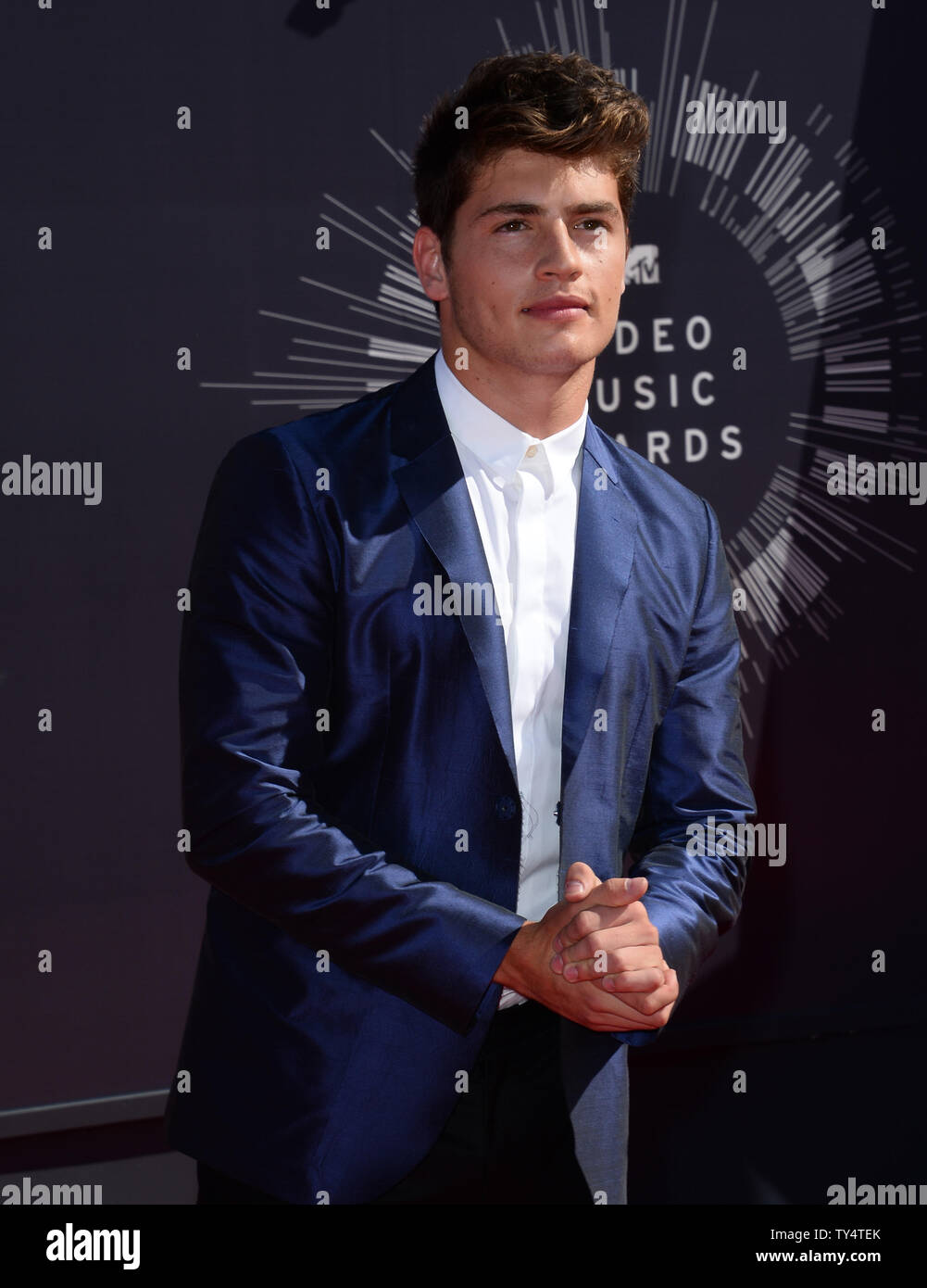 Gregg Sulkin arrives at the 2014 MTV Video Music Awards at the Forum in ...