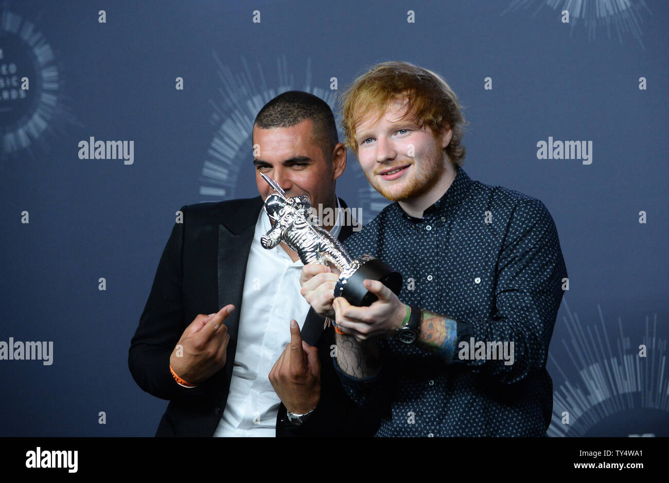 Emil Nava, left, and Ed Sheeran, winner of Best Male Video, pose ...