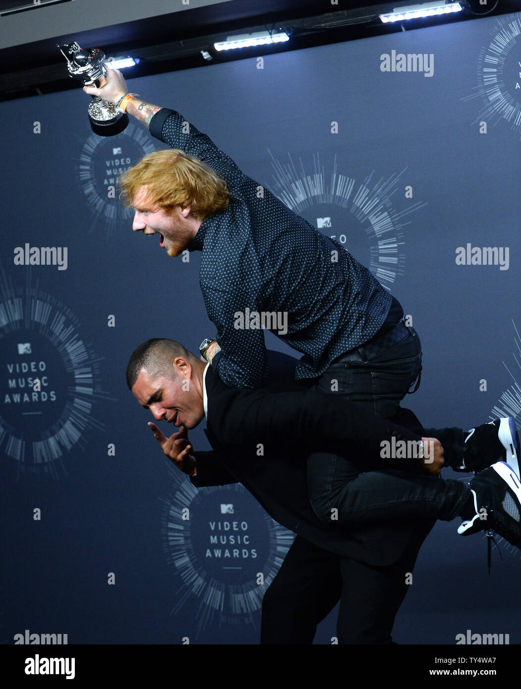 Emil Nava, and Ed Sheeran, winner of Best Male Video, pose backstage at ...