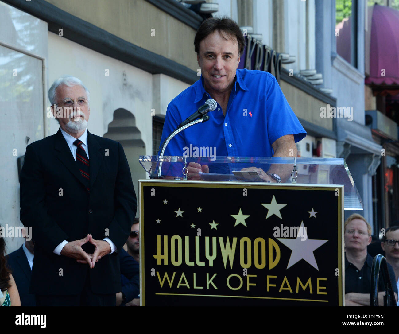 John Hartmann (L) listens to actor Kevin Nealon during a Hollywood Walk ...
