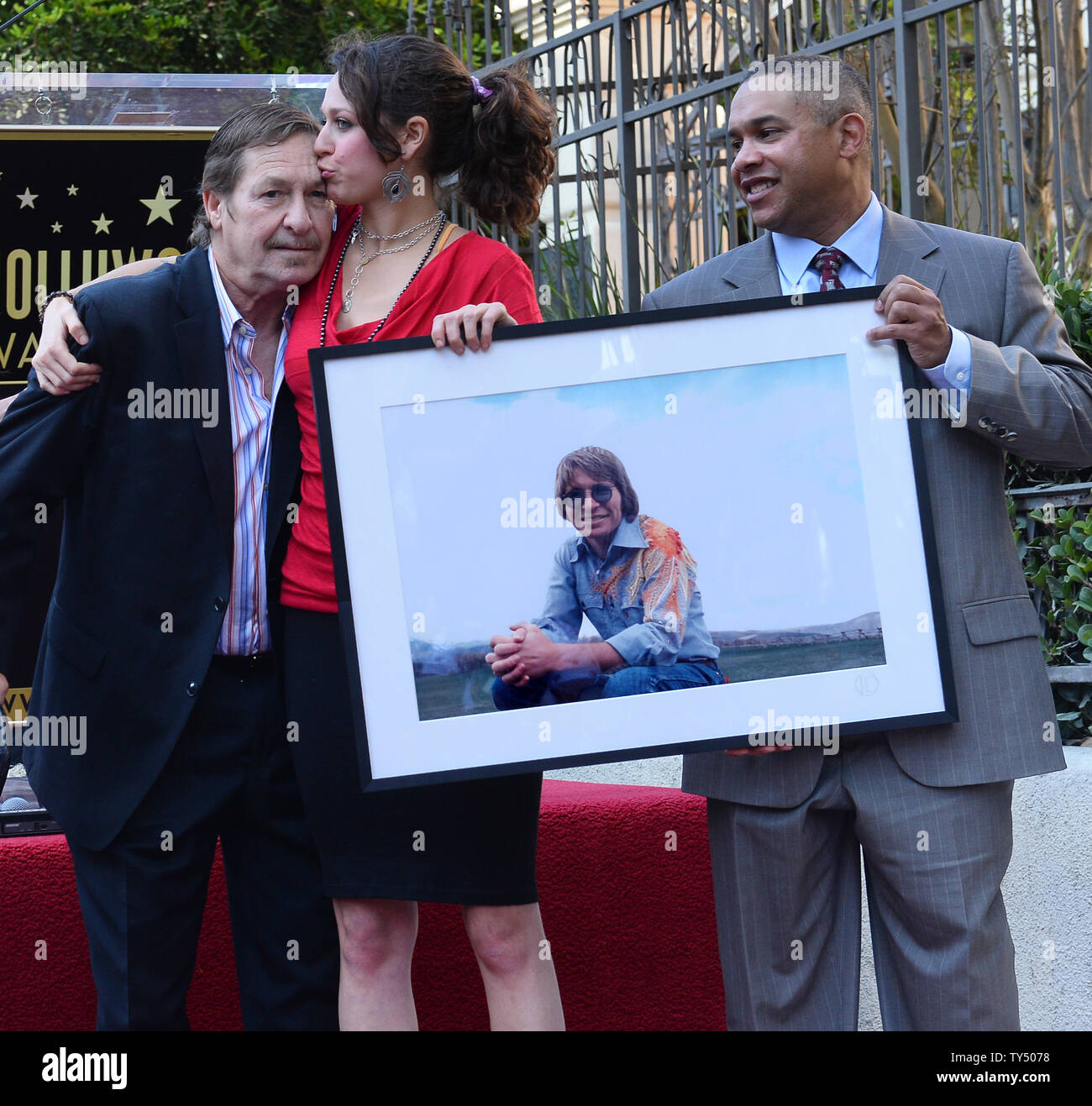 Jesse Belle Denver (C) and Zachary Deutschendorf, two of singer John ...