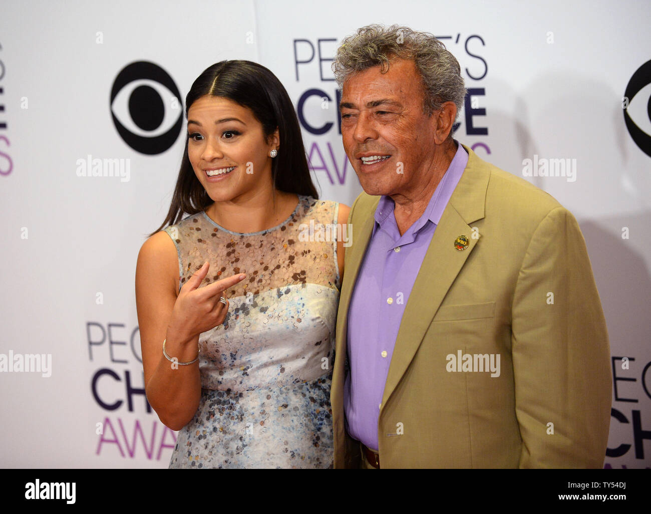 Actress Gina Rodriguez and boxing referee Genaro Rodriguez pose ...