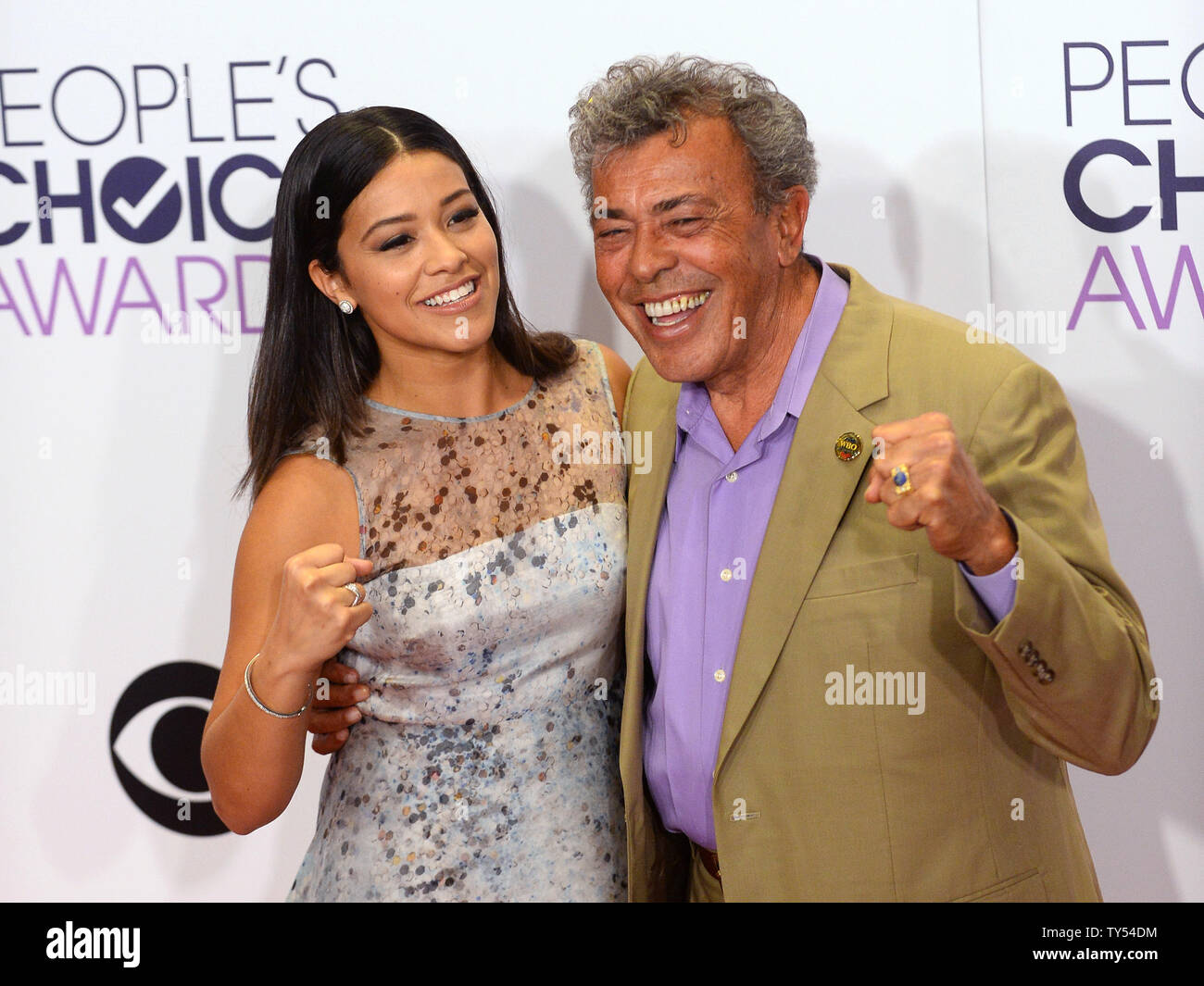 Actress Gina Rodriguez and boxing referee Genaro Rodriguez pose ...