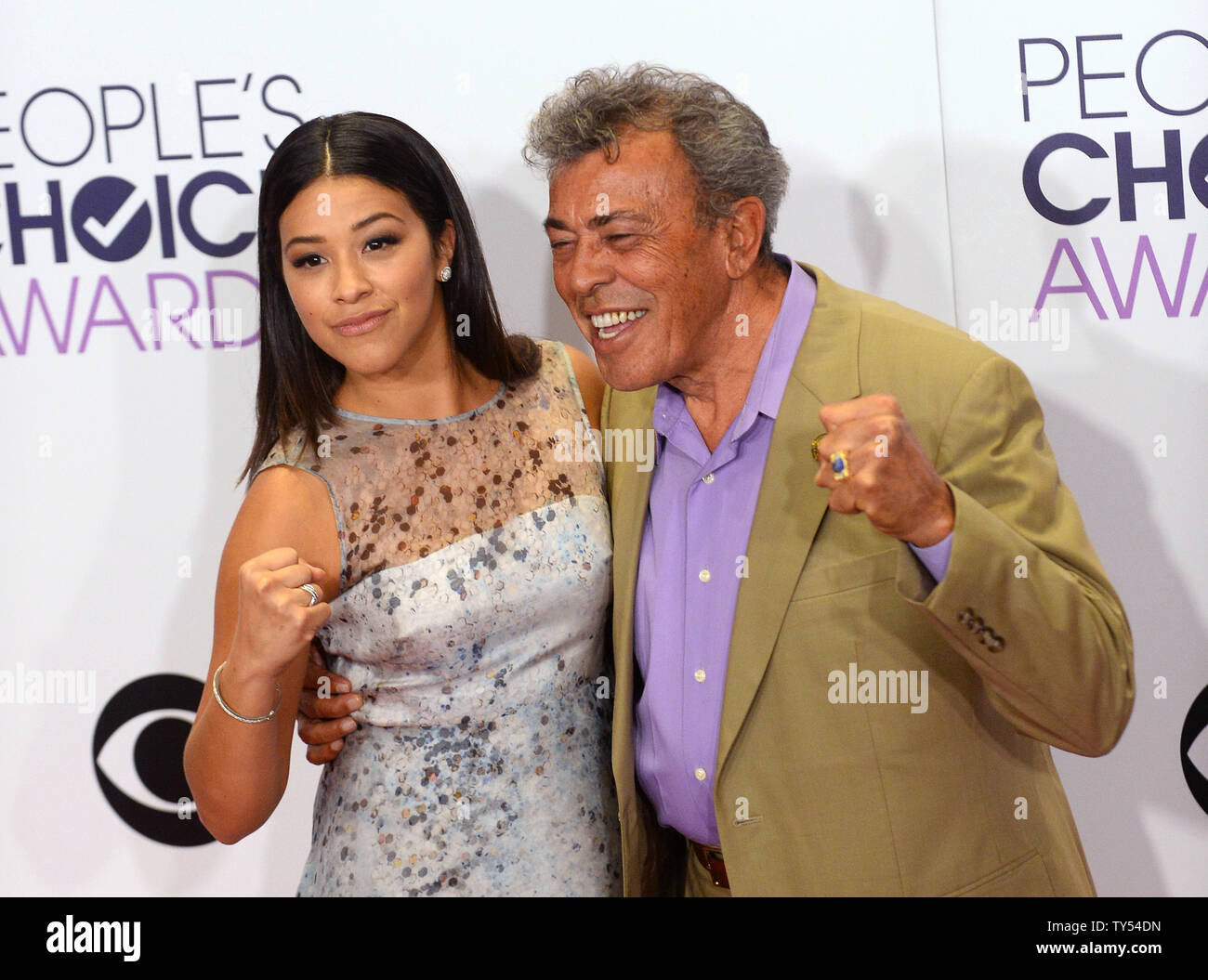 Actress Gina Rodriguez and boxing referee Genaro Rodriguez pose ...