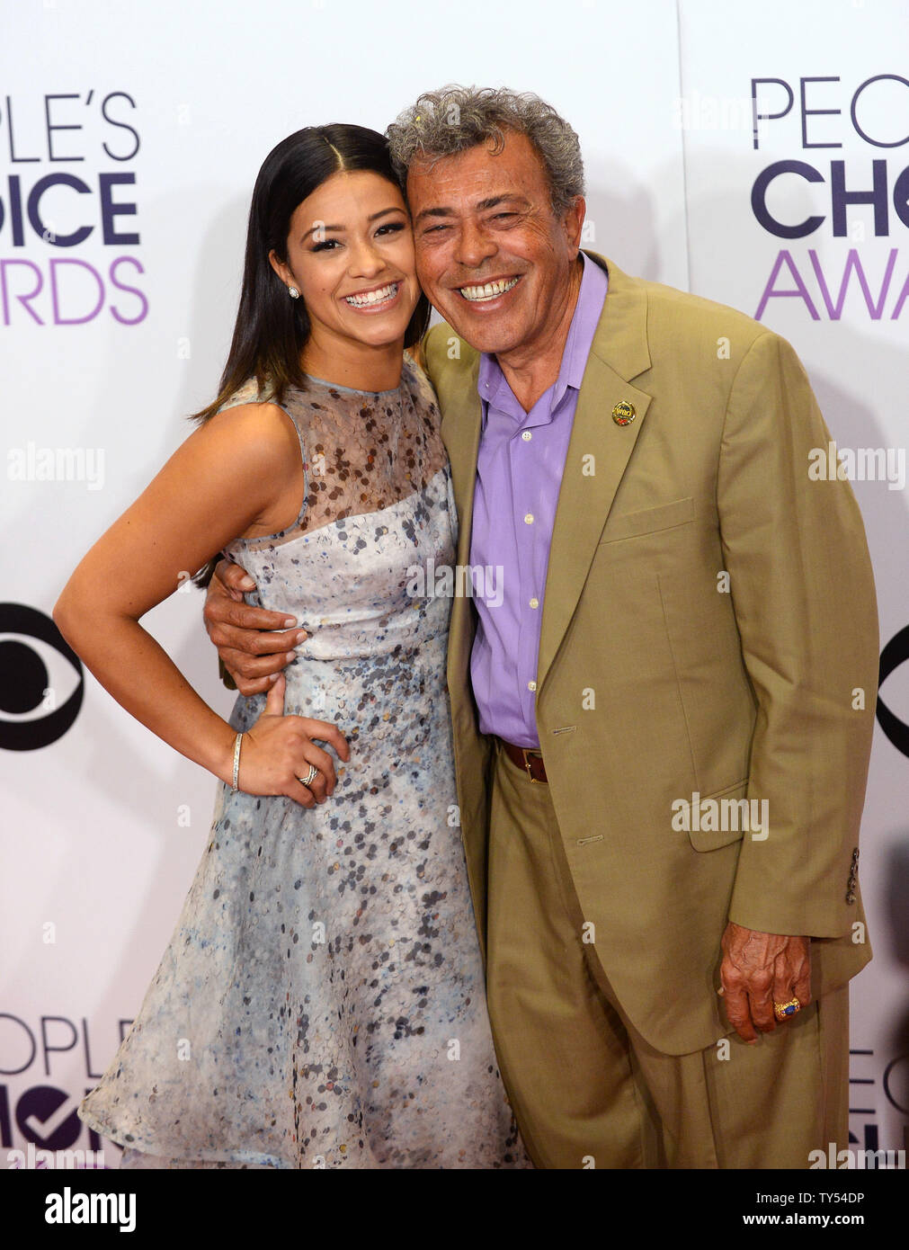Actress Gina Rodriguez and boxing referee Genaro Rodriguez pose ...