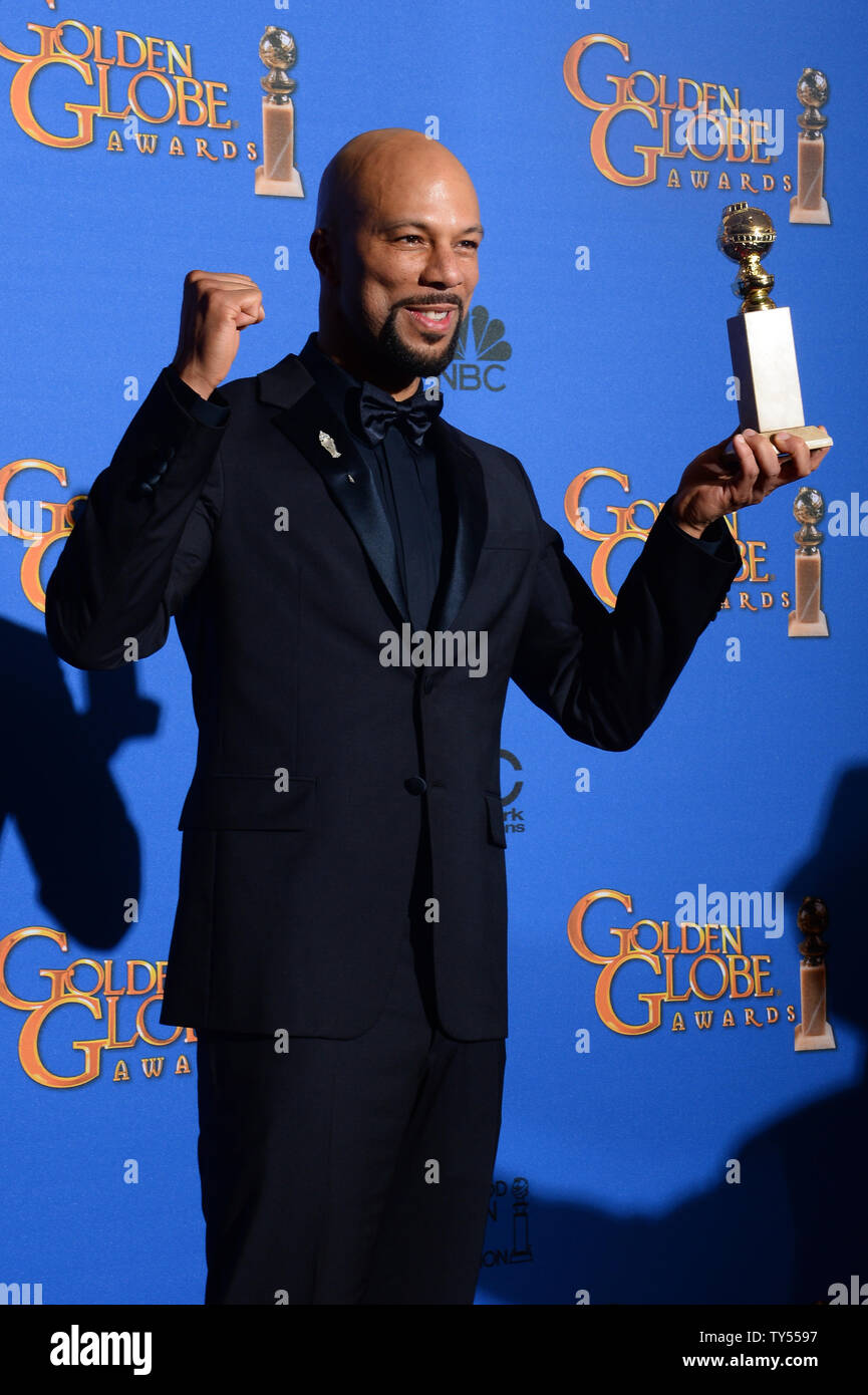 Common appears backstage with the award for Original Song, Motion ...