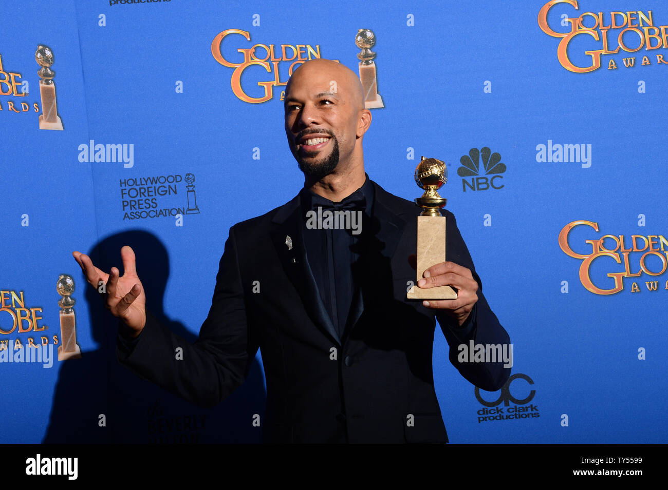 Common appears backstage with the award for Original Song, Motion ...
