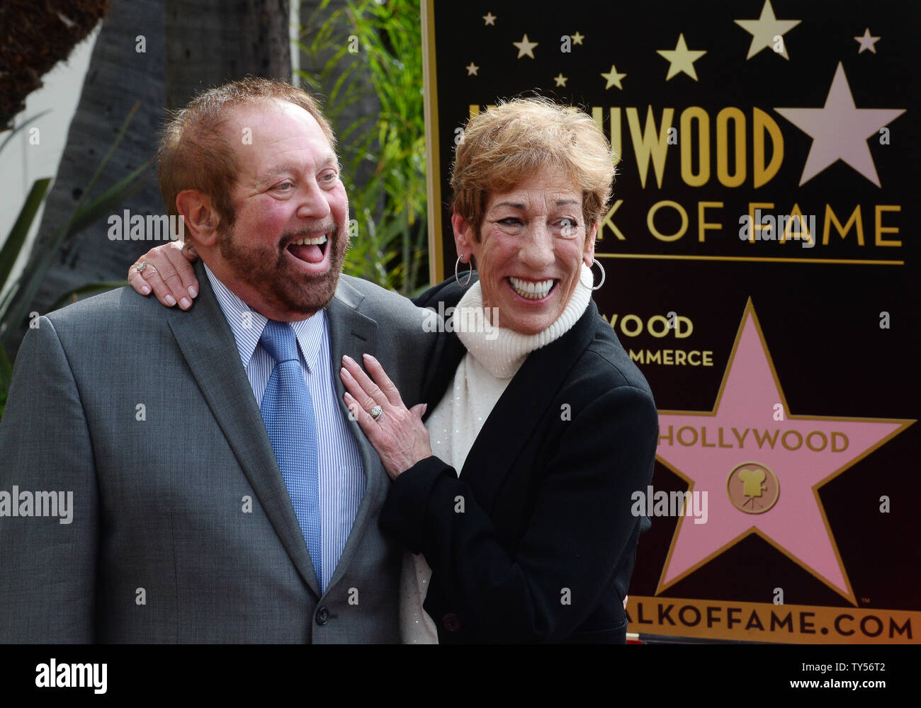 Television producer Ken Ehrlich is congratulated by his wife Harriet ...