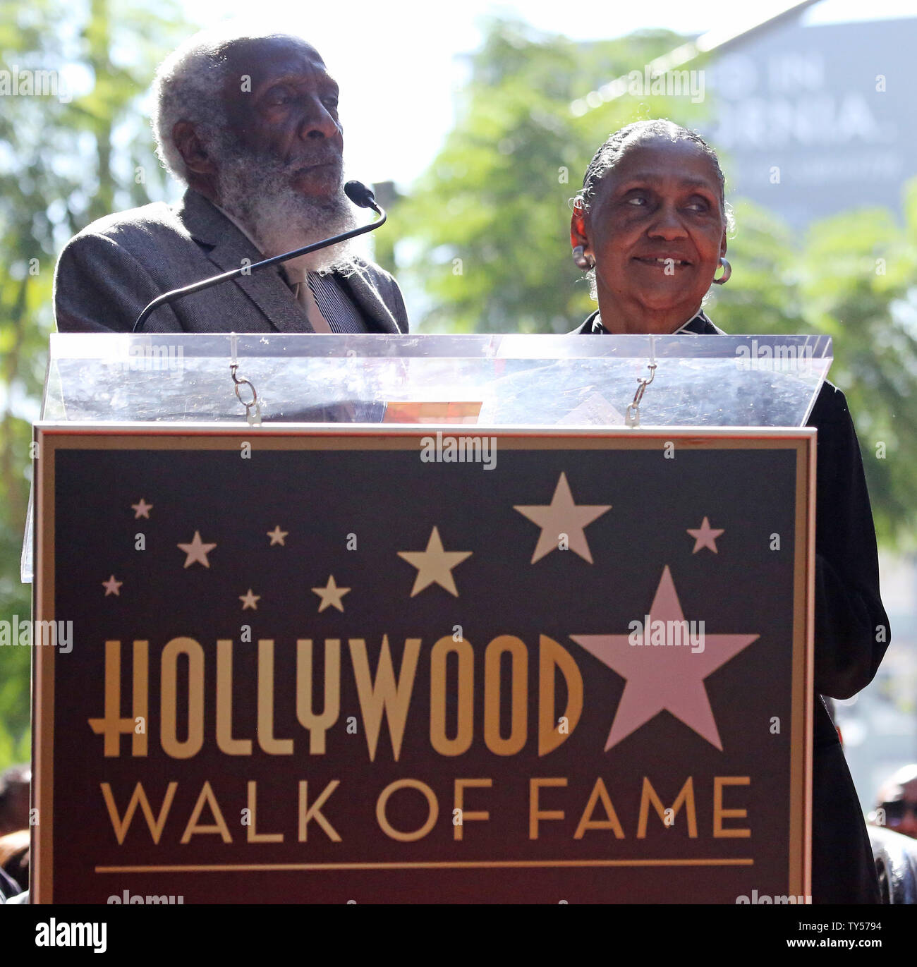 Dick Gregory (C) and his wife Lillian address attendees during the ...