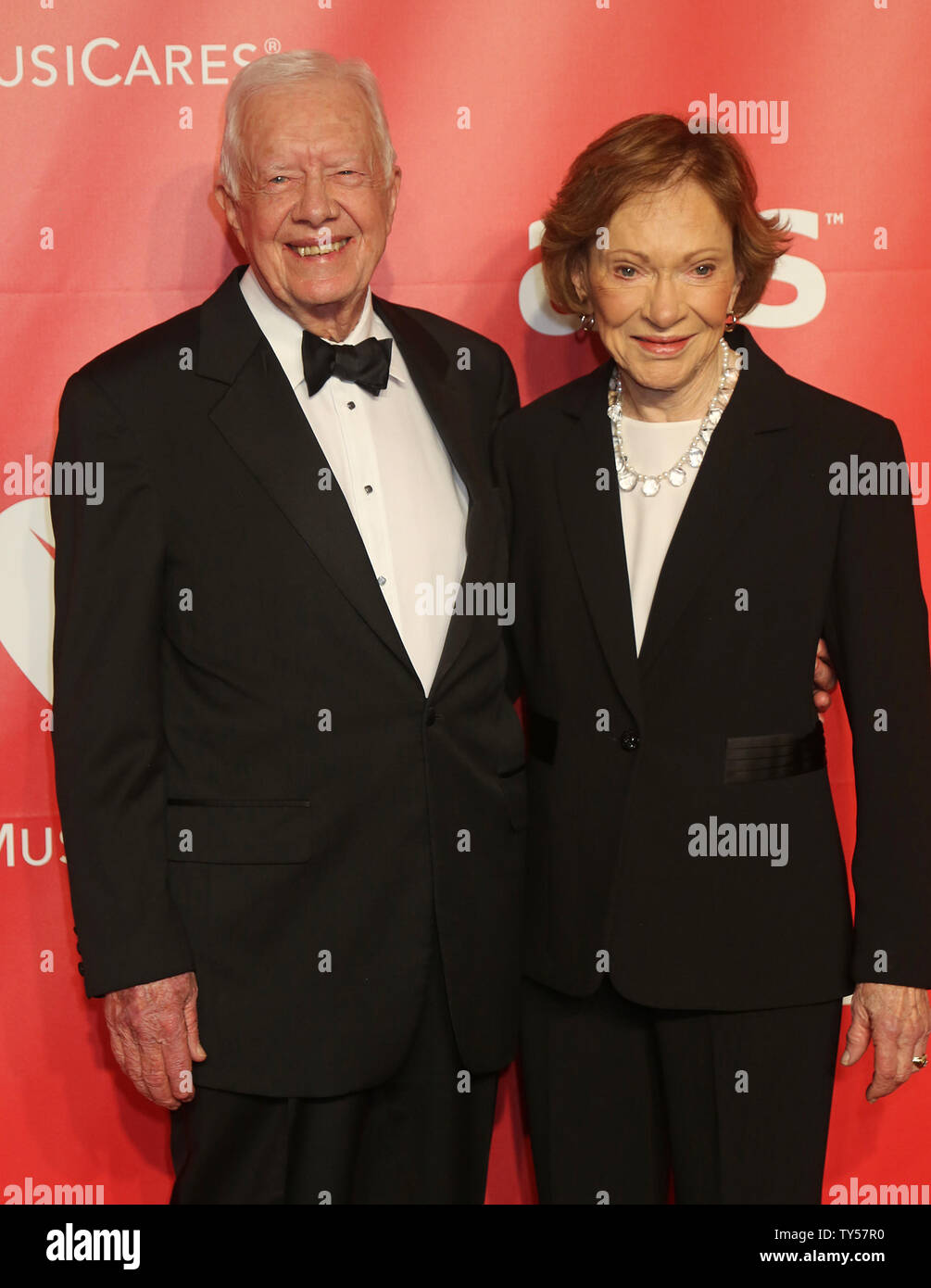 Former U.S. President Jimmy Carter and his wife Rosalynn Carter attend ...