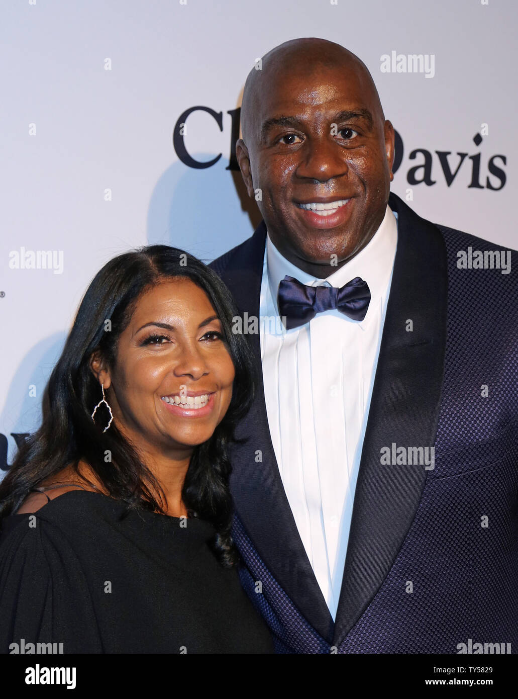 Magic Johnson and his wife Cookie arrive on the red carpet before the ...
