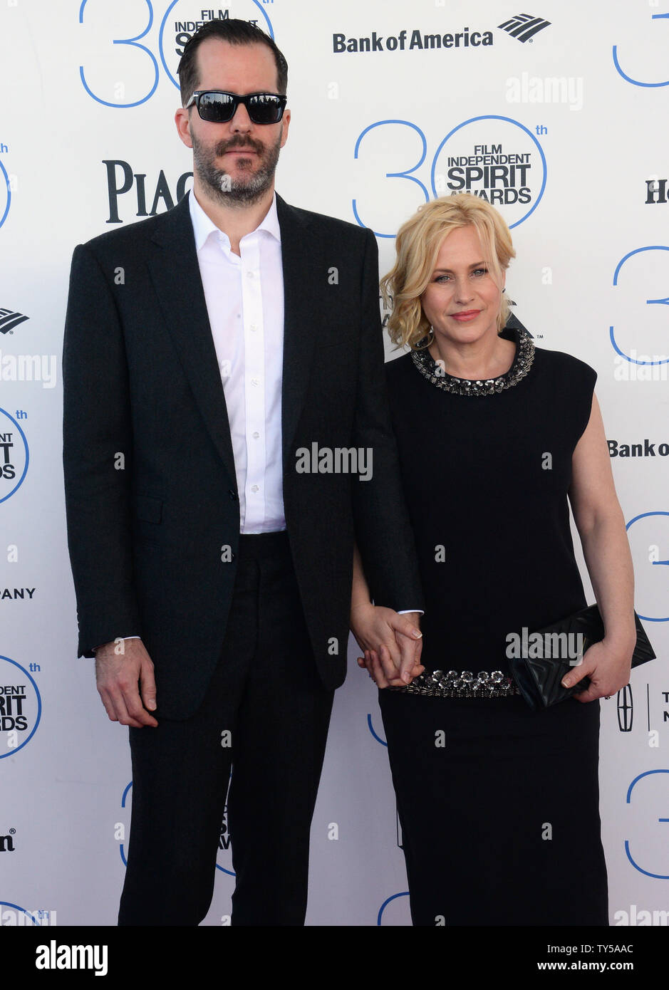 Eric White, left, and actress Patricia Arquette attend the 30th annual ...