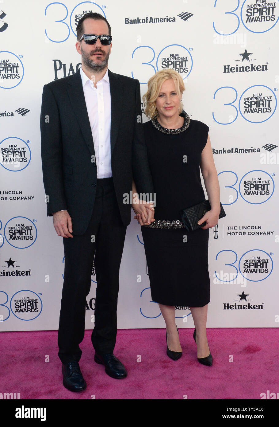 Eric White, left, and actress Patricia Arquette attend the 30th annual ...