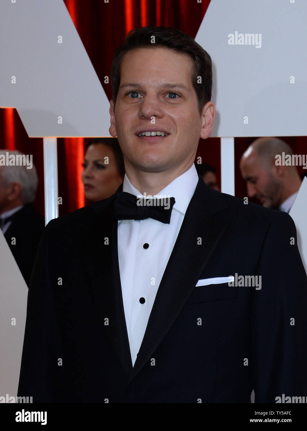 Graham Moore arrives at the 87th Academy Awards at the Hollywood ...