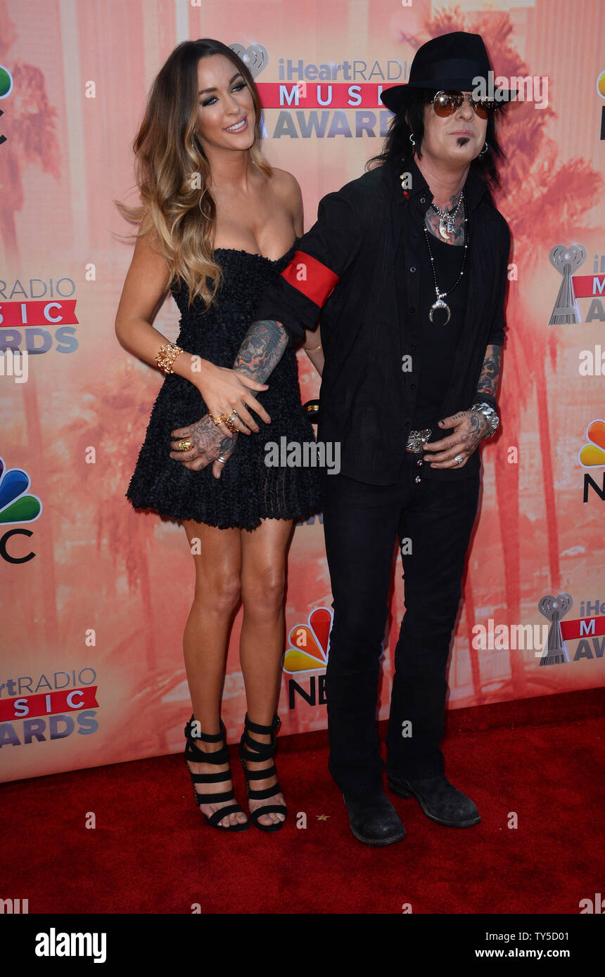 Musician Niki Sixx, right, and Courtney Bingham attend the iHeartRadio ...