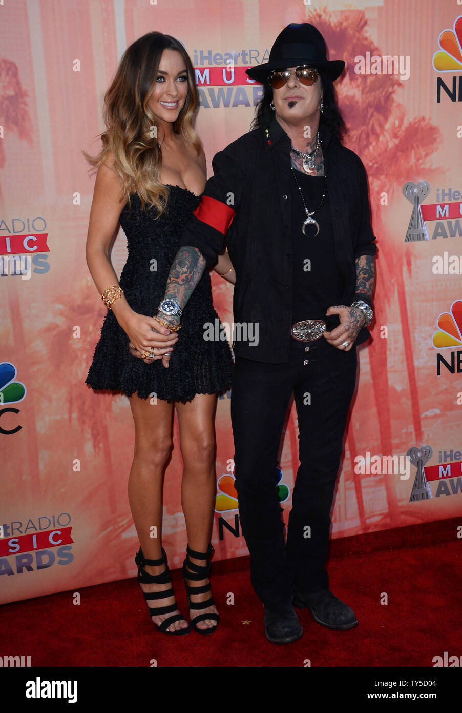 Musician Niki Sixx, right, and Courtney Bingham attend the iHeartRadio ...