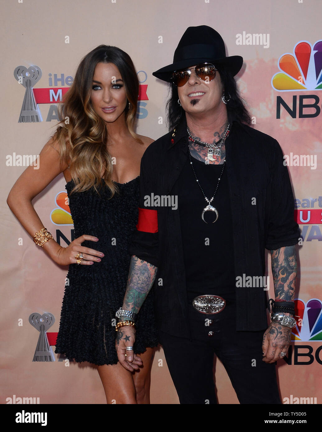 Musician Niki Sixx, right, and Courtney Bingham attend the iHeartRadio ...