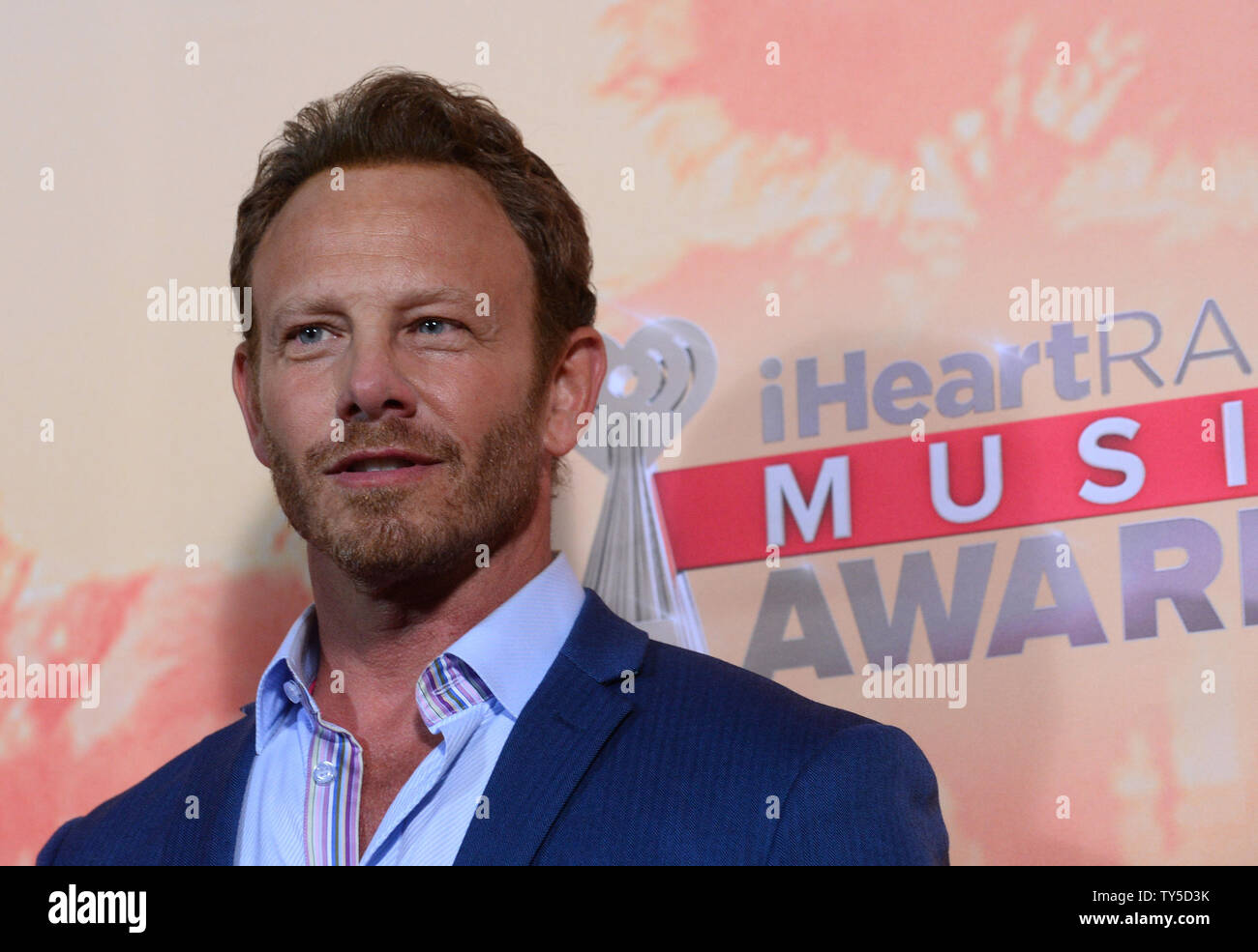 Actor Ian Ziering poses backstage at the iHeartRadio Music Awards at ...