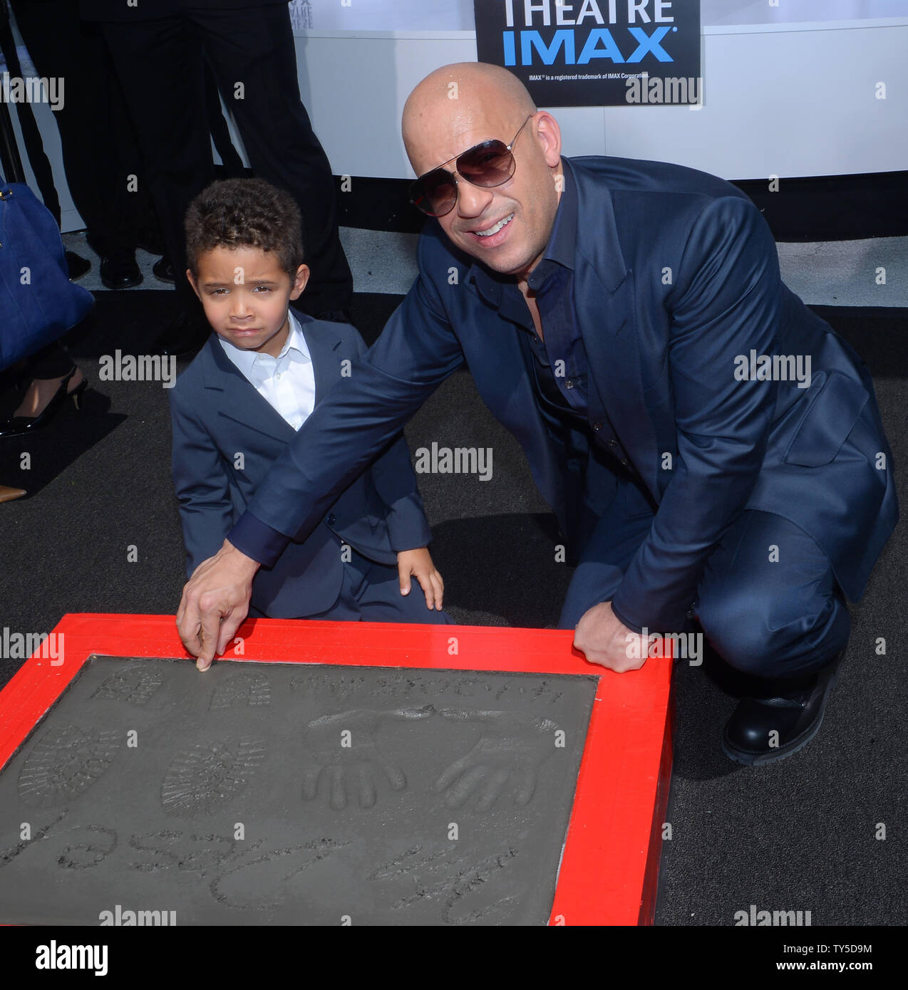 Actor Vin Diesel and his son Vincent Sinclair participate in a hand ...
