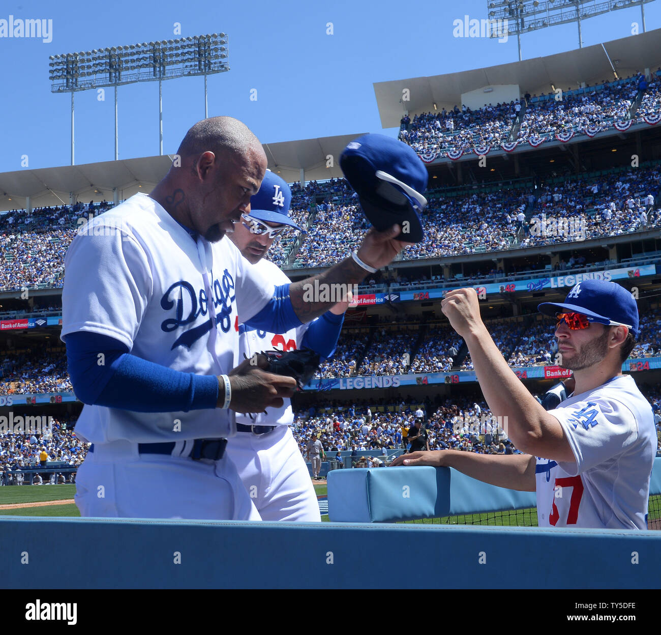 Los Angeles Dodgers' pitcher Brandon Beachy (17) welcomes outfielder ...