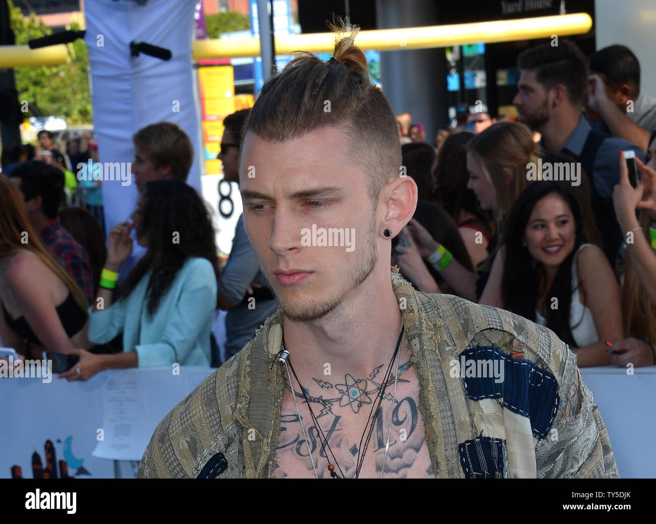 Rapper Machine Gun Kelly arrives for the MTV Movie Awards at Nokia ...