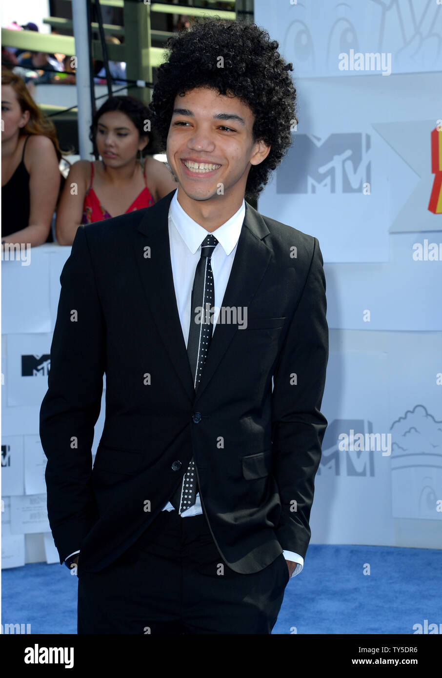 Actor Justice Smith arrives for the MTV Movie Awards at Nokia Theatre L ...