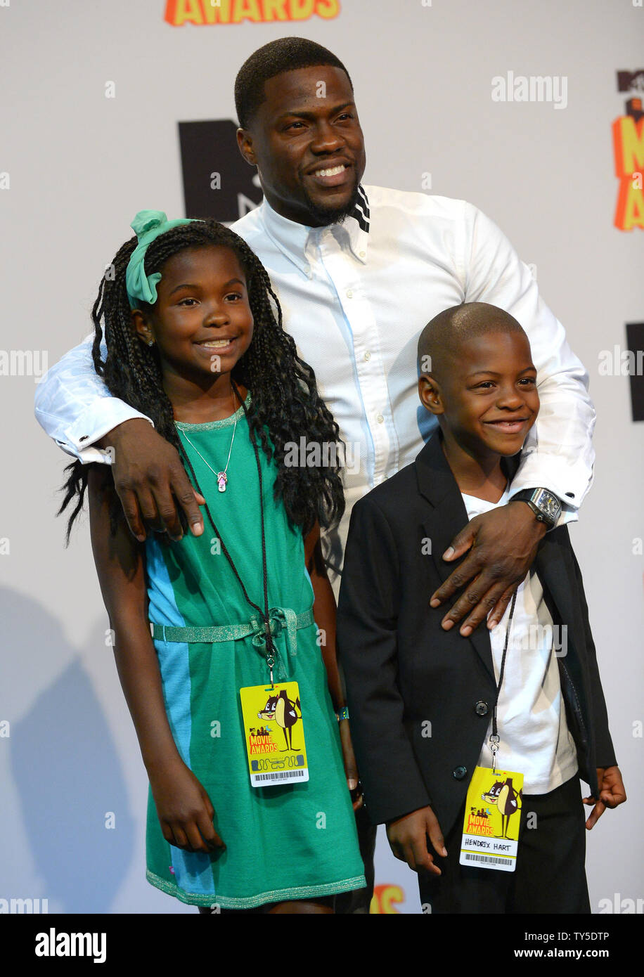 Kevin Hart, winner of the comedic genius award, poses in the press room ...