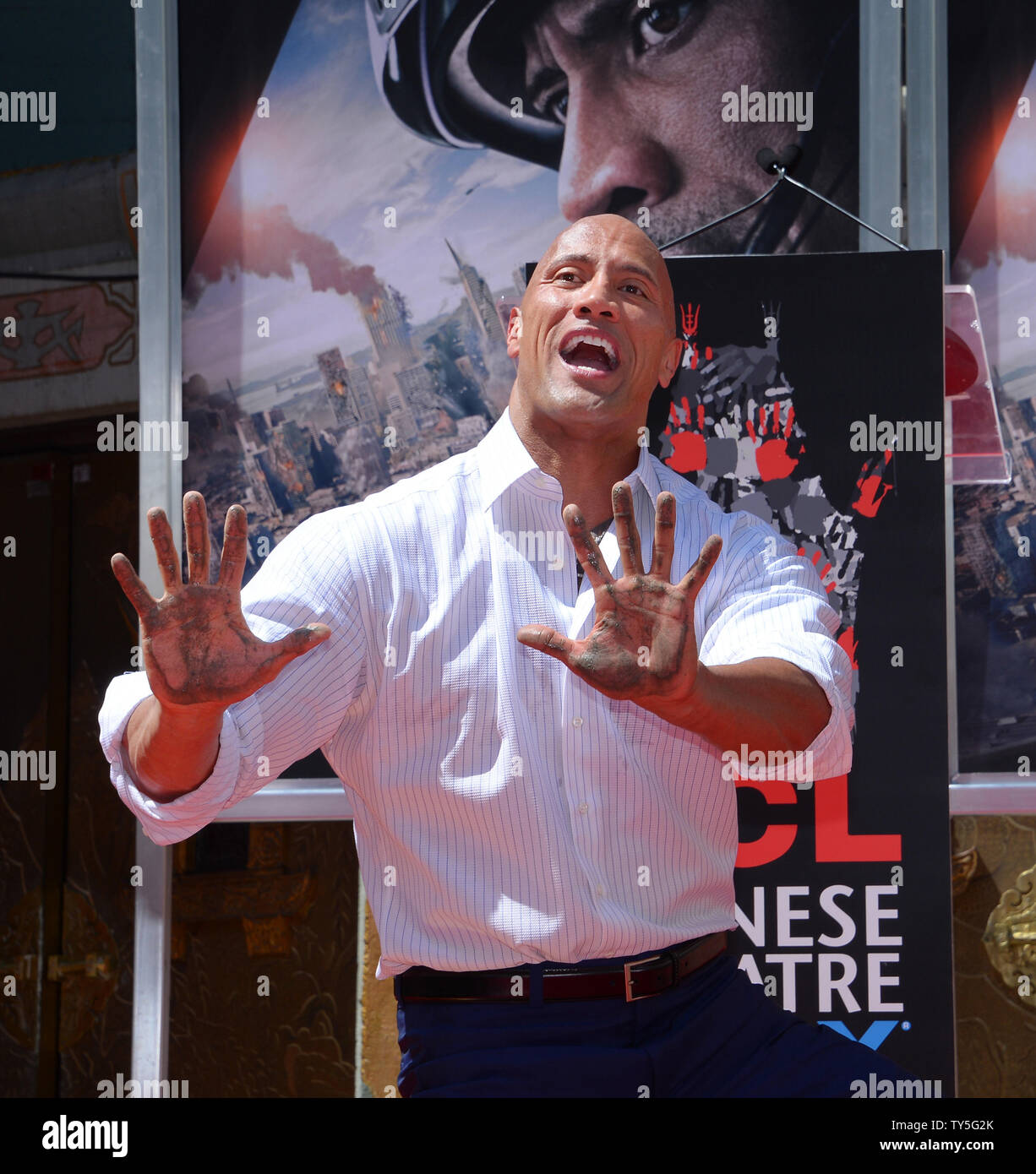 Actor Dwayne "The Rock" Johnson participates in a hand & footprint ...
