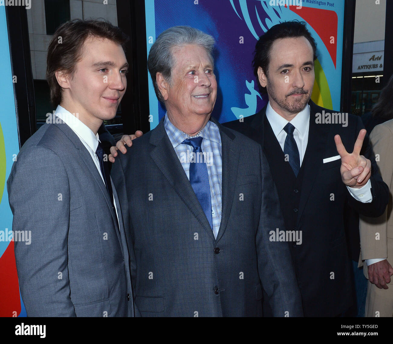 Musician Brian Wilson (C) gathers with cast members Paul Dano (L) and ...