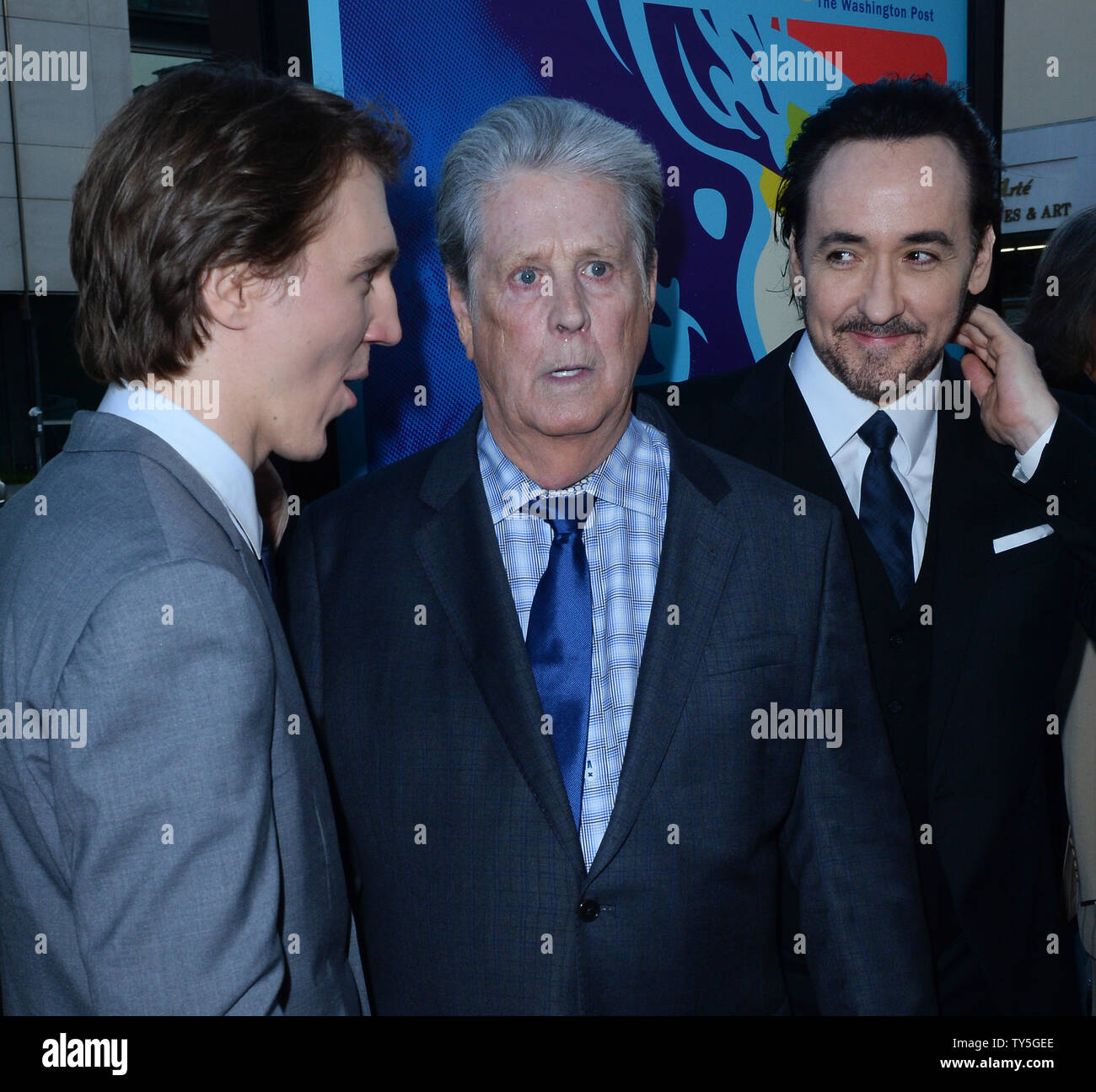 Musician Brian Wilson (C) gathers with cast members Paul Dano (L) and ...