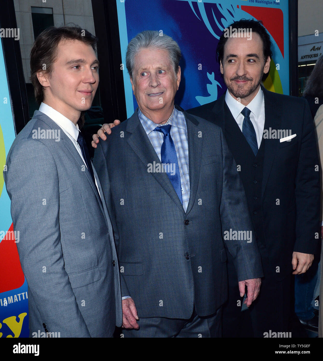 Musician Brian Wilson (C) gathers with cast members Paul Dano (L) and ...