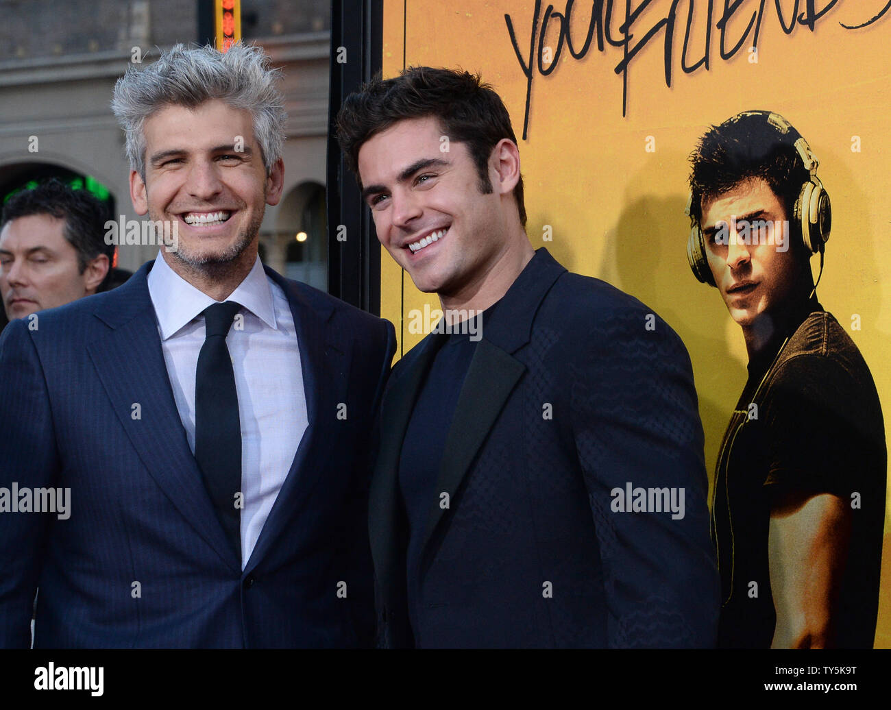 Writer and director Max Joseph (L) and cadt member Zac Efron attend the ...