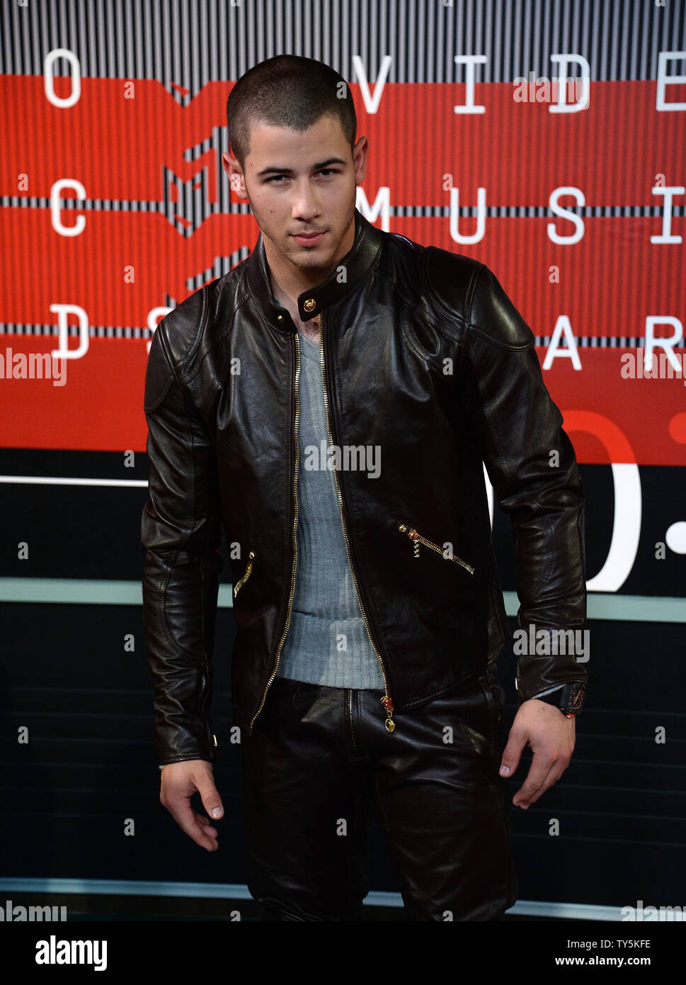 Singer/actor Nick Jonas arrives on the red carpet for the 32nd annual ...