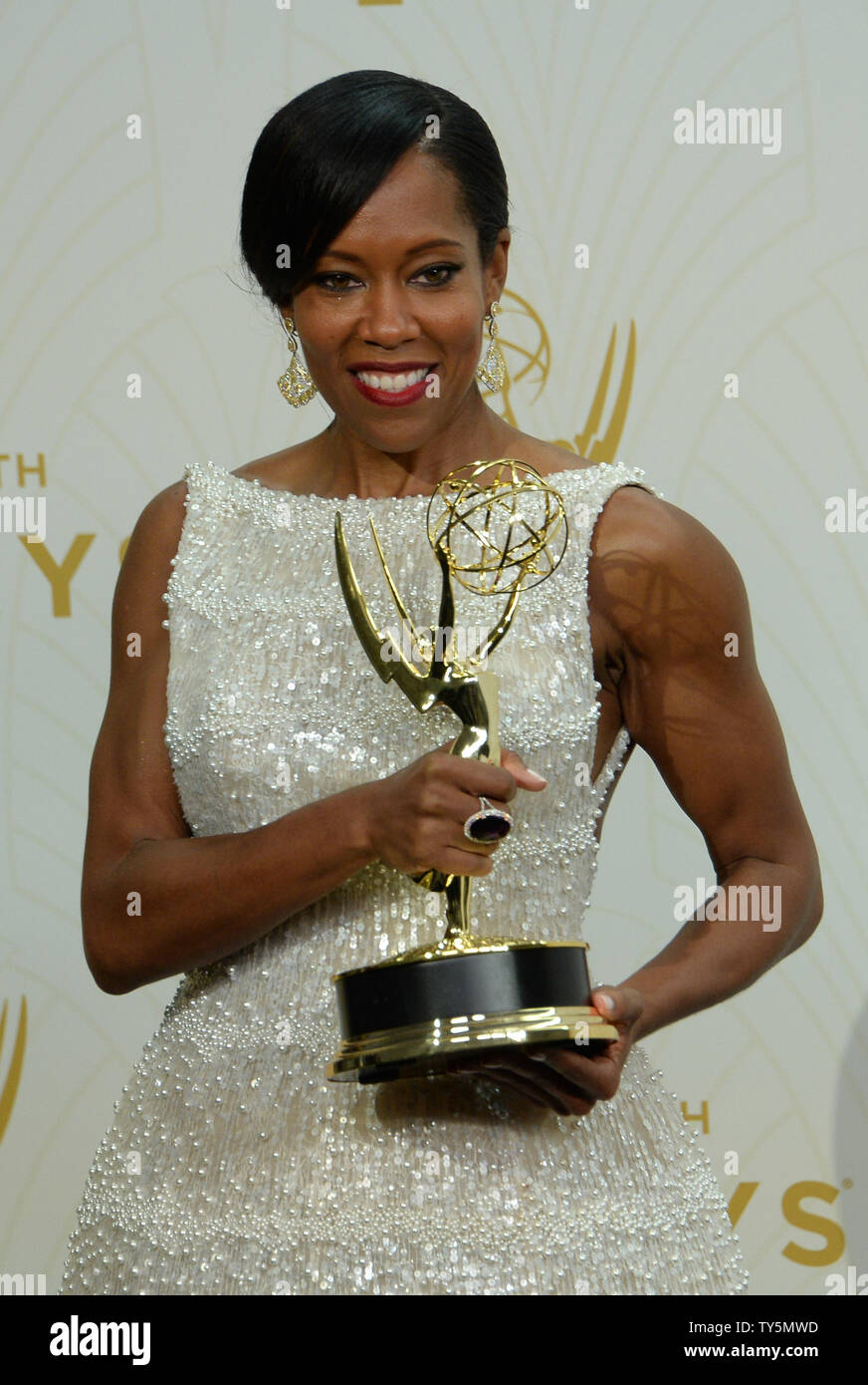 Actress Regina King holds her Emmy for Outstanding Supporting Actress ...