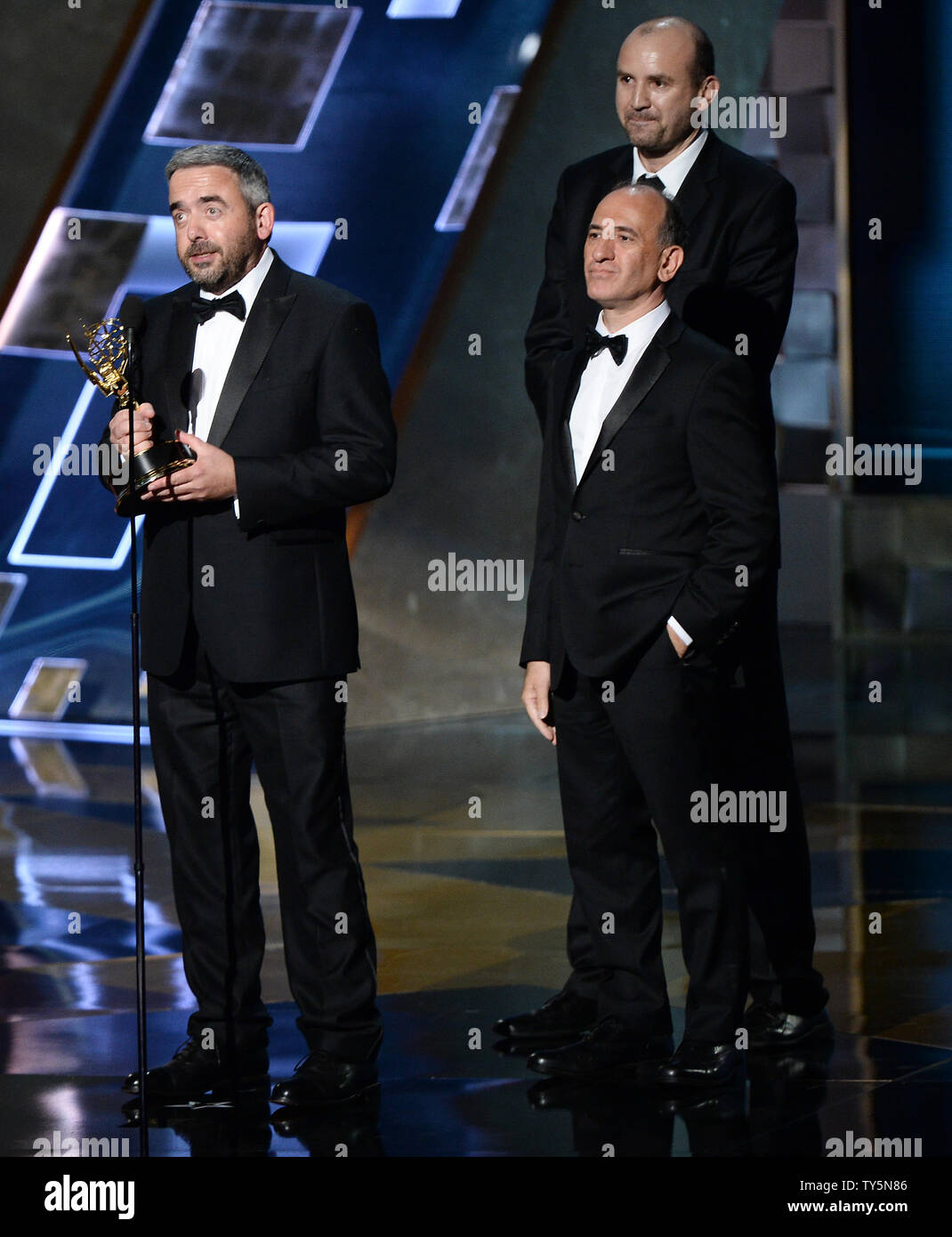 (L-R) Writers Simon Blackwell, Tony Roche and Armando Iannucci accept ...