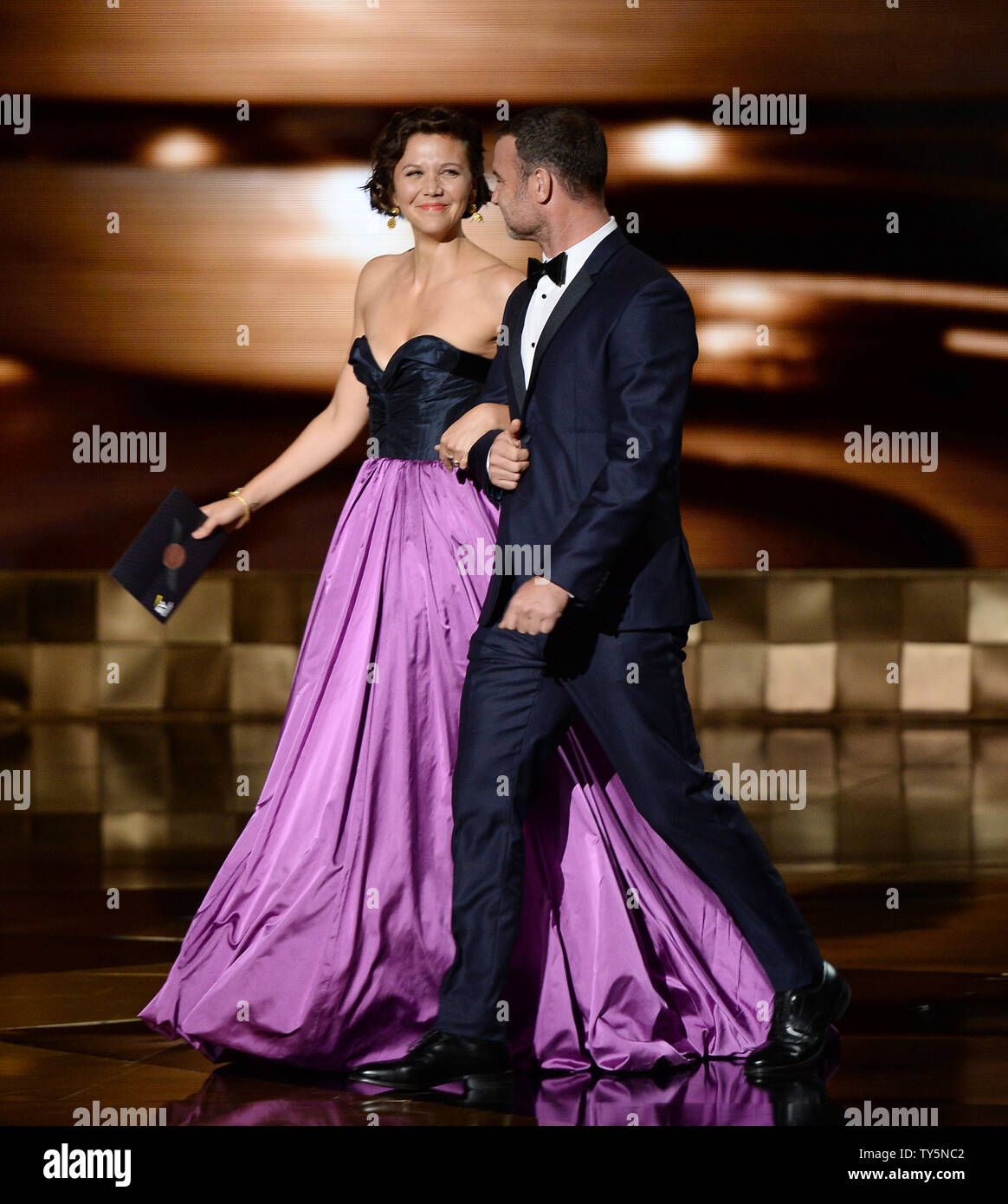 Actress Maggie Gyllenhaal (L) and actor Liev Schreiber appear onstage ...