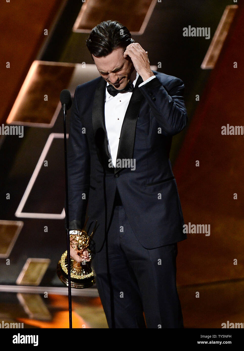 Actor Jon Hamm accepts the award for Outstanding Lead Actor in a Drama ...