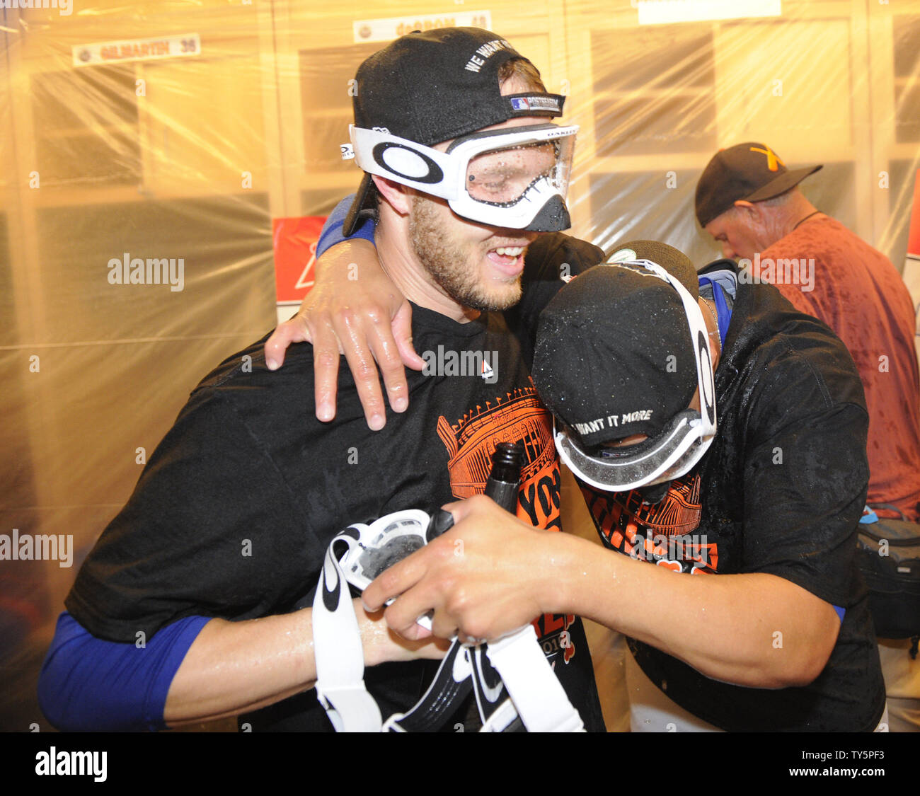 New York Mets celebrate in the locker room after game 5 of the National ...