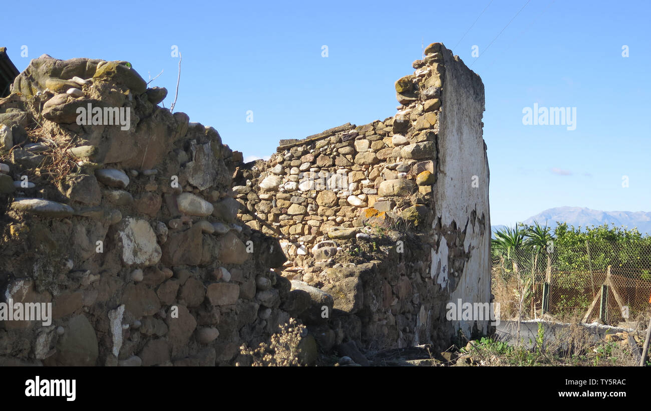 Thick stone and mud constructed wall remnants at abandoned farmhouse in ...