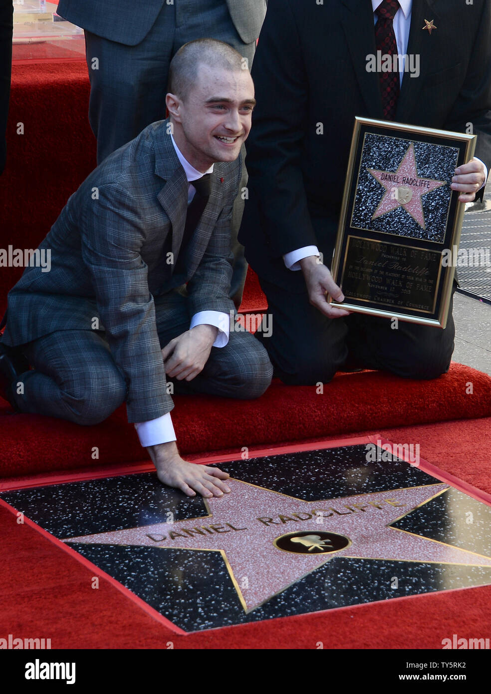 English actor Daniel Radcliffe touches his star during an unveiling ...