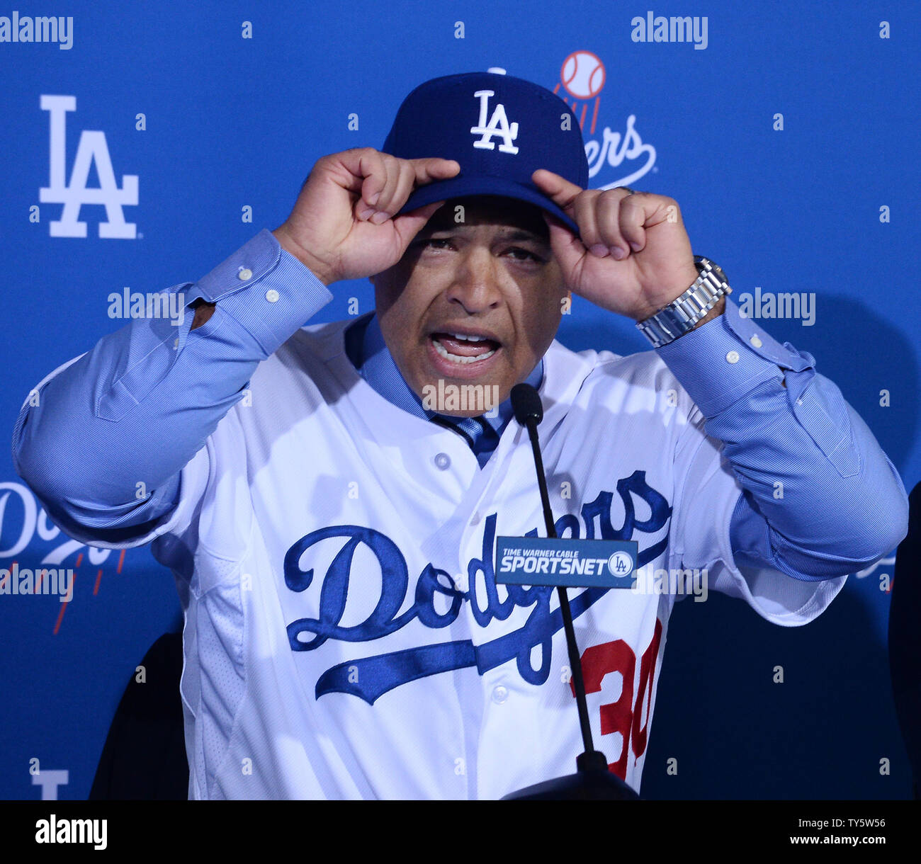 Dave Roberts, a former Dodger dons his new jersey as he is introduced ...