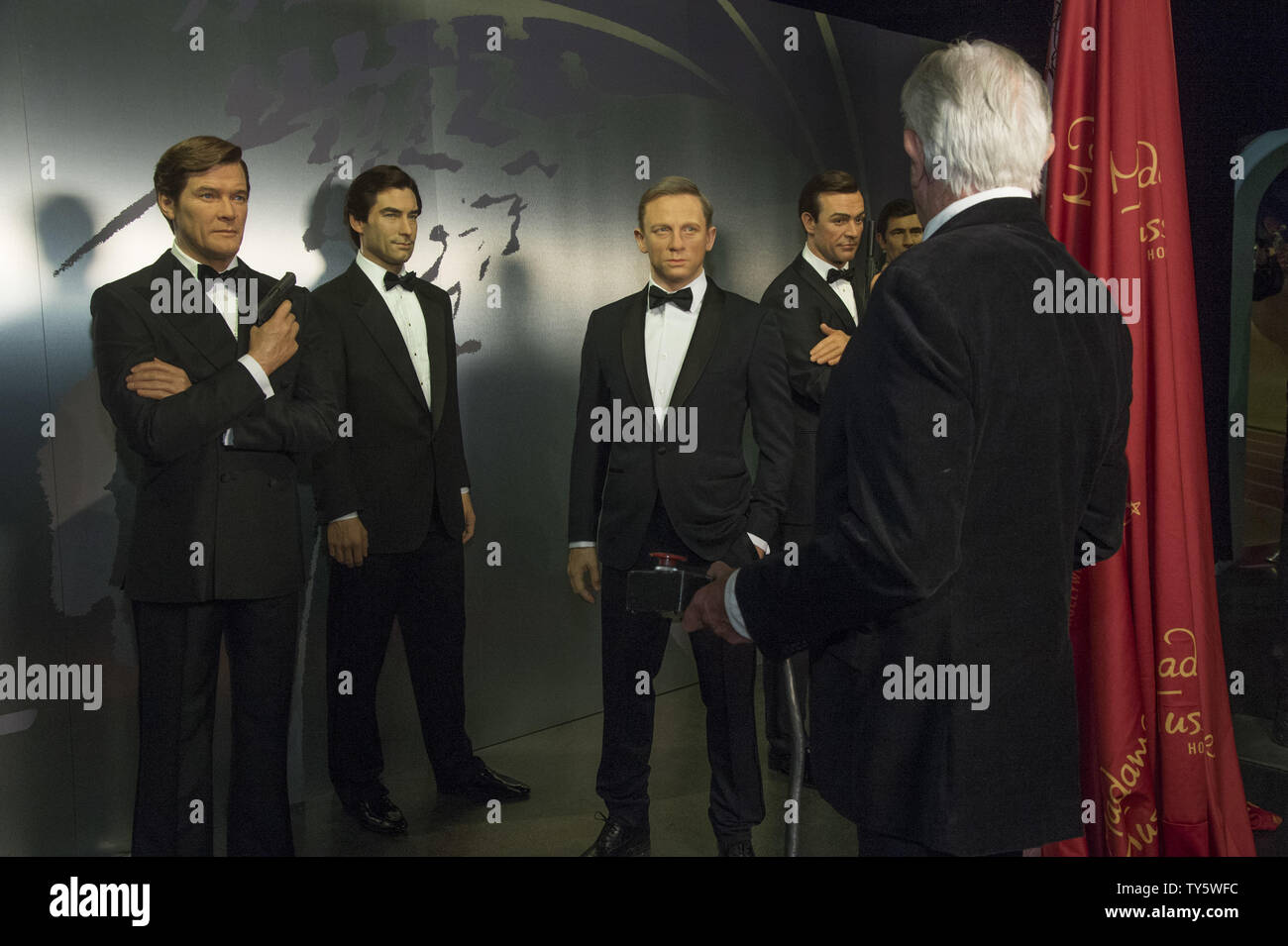 Actor George Lazenby participates in the unveiling of the Wax figures ...