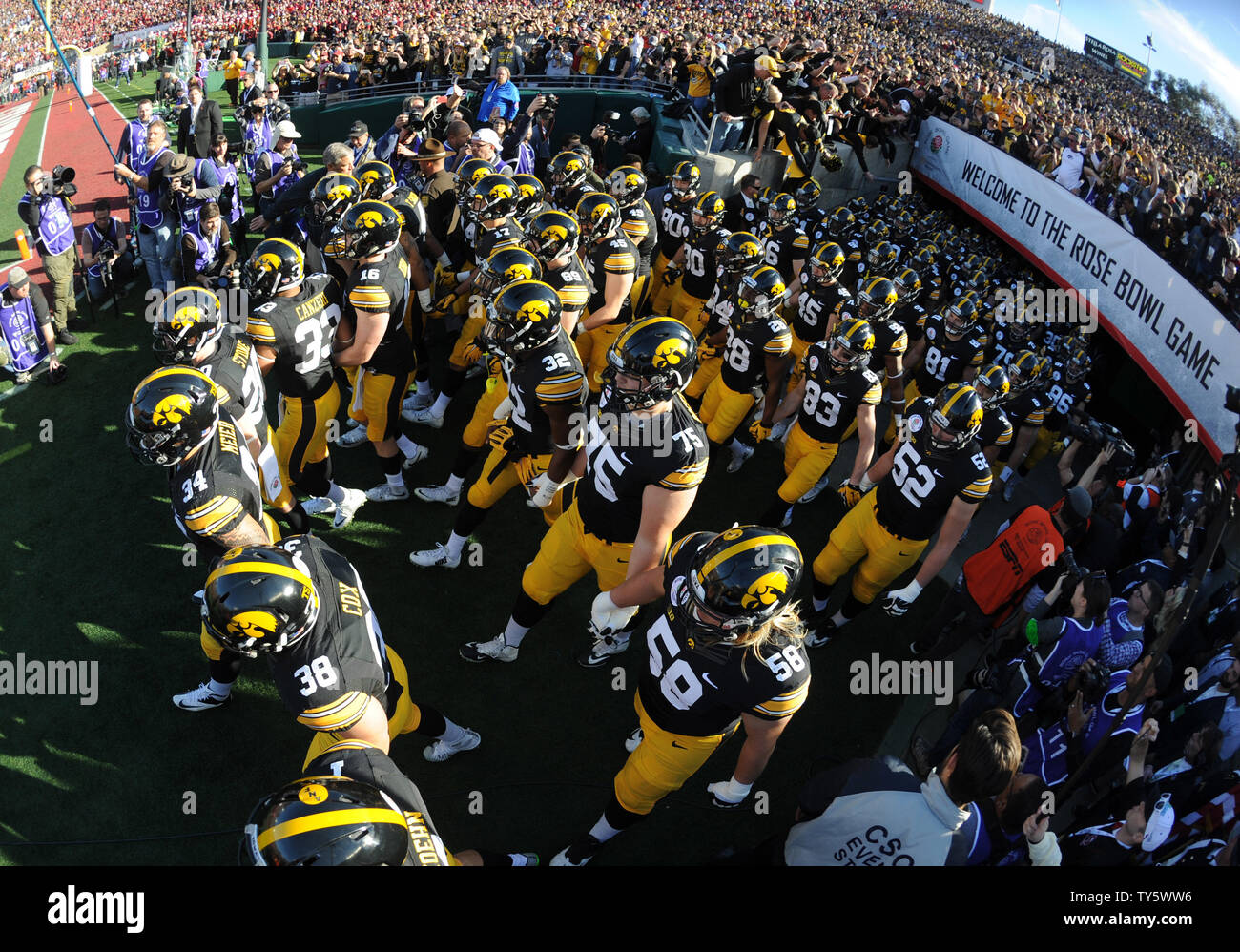 Iowa Hawkeyes enter the field at the 102nd Rose Bowl game in Pasadena ...