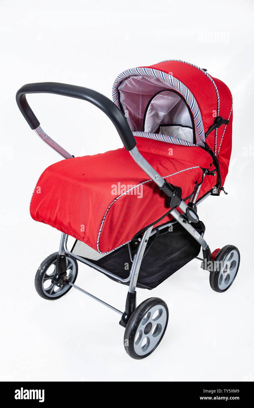 Baby carriage on an isolated studio background Stock Photo - Alamy