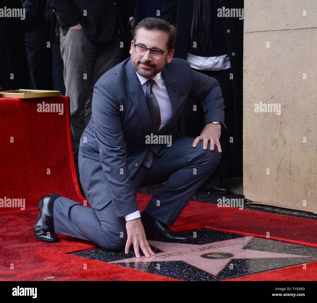 Actor Steve Carrell touches his star during an unveiling ceremony ...